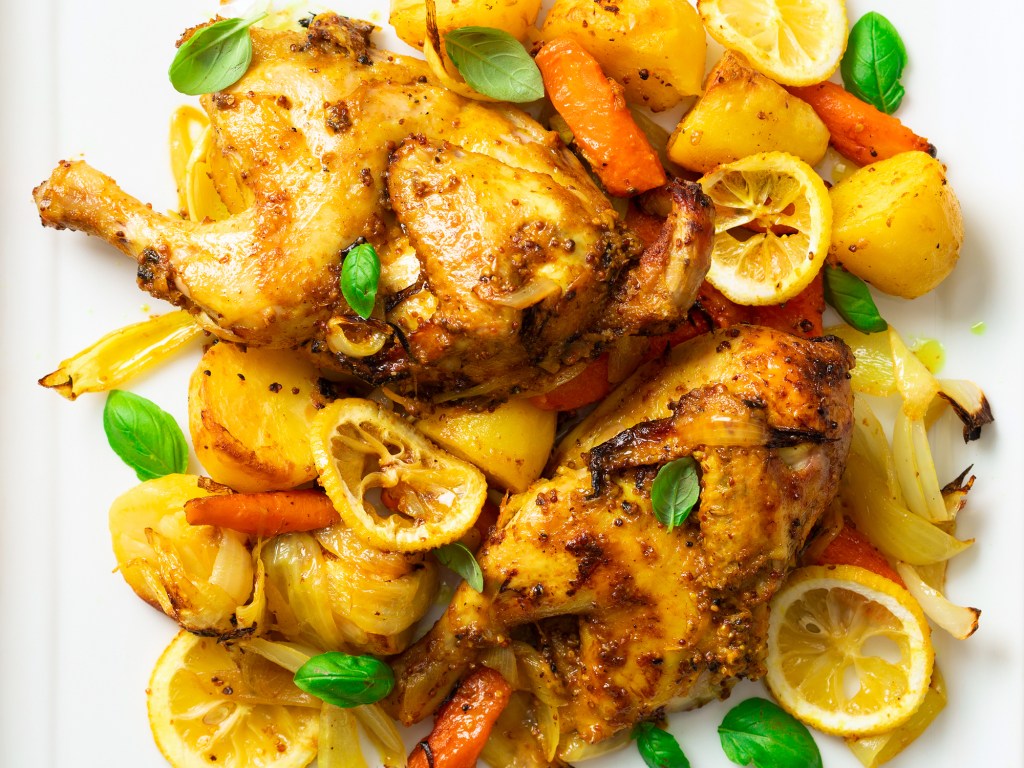 POUSSIN CHICKEN WITH BAKED POTATOES, CARROTS, AND LEMON